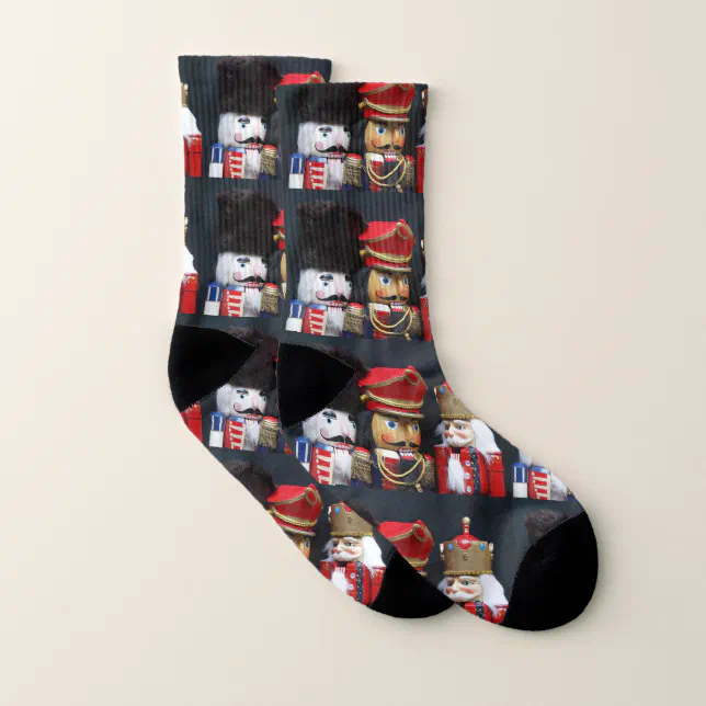 Three nutcrackers on dark background socks | Zazzle