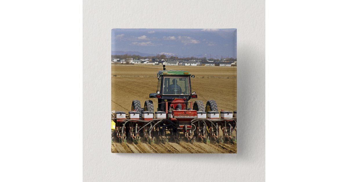 Tractor pulling a seed corn planter. pinback button | Zazzle