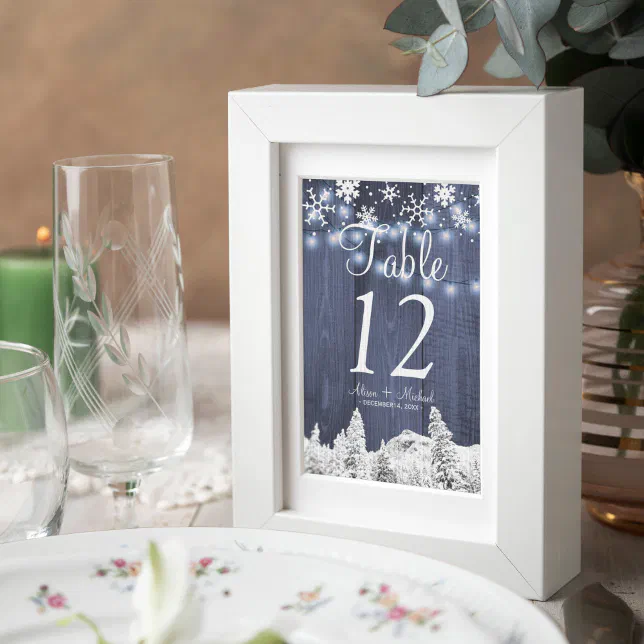 Twinkle lights wonderland snowflakes wedding table number | Zazzle