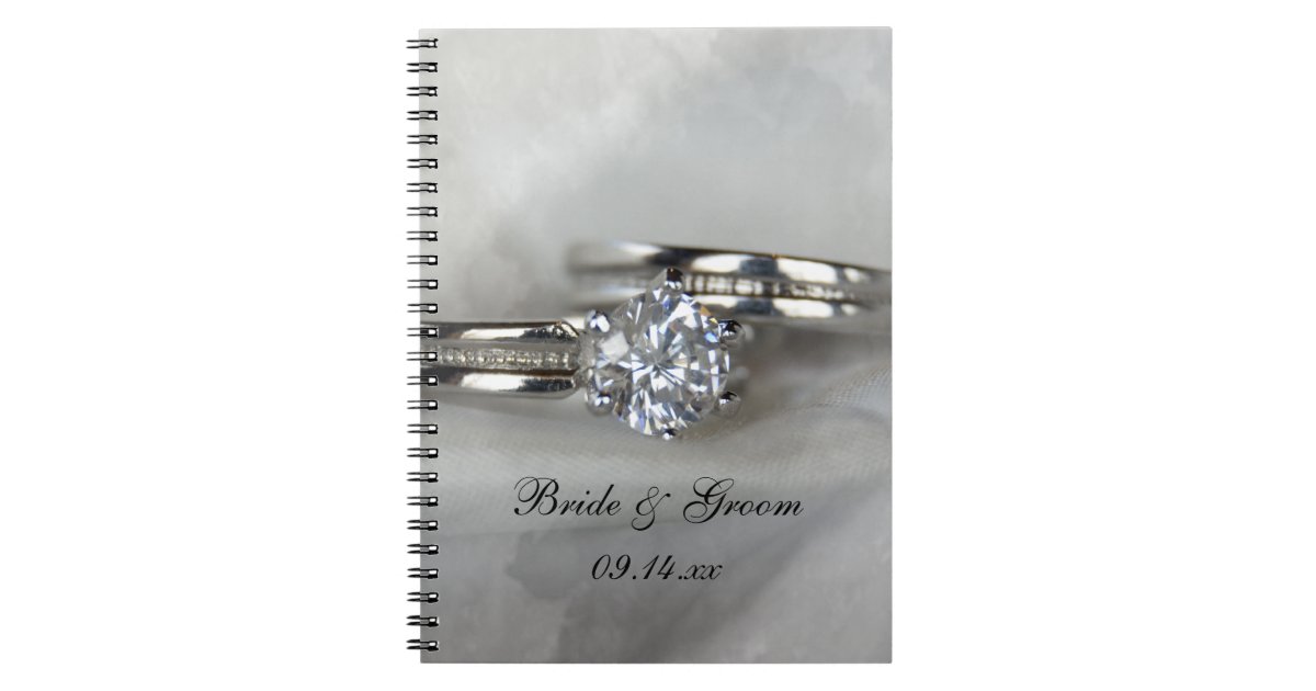 Wedding Rings on Gray Notebook | Zazzle