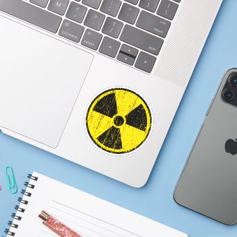 Worn, distressed nuclear radiation symbol sticker | Zazzle